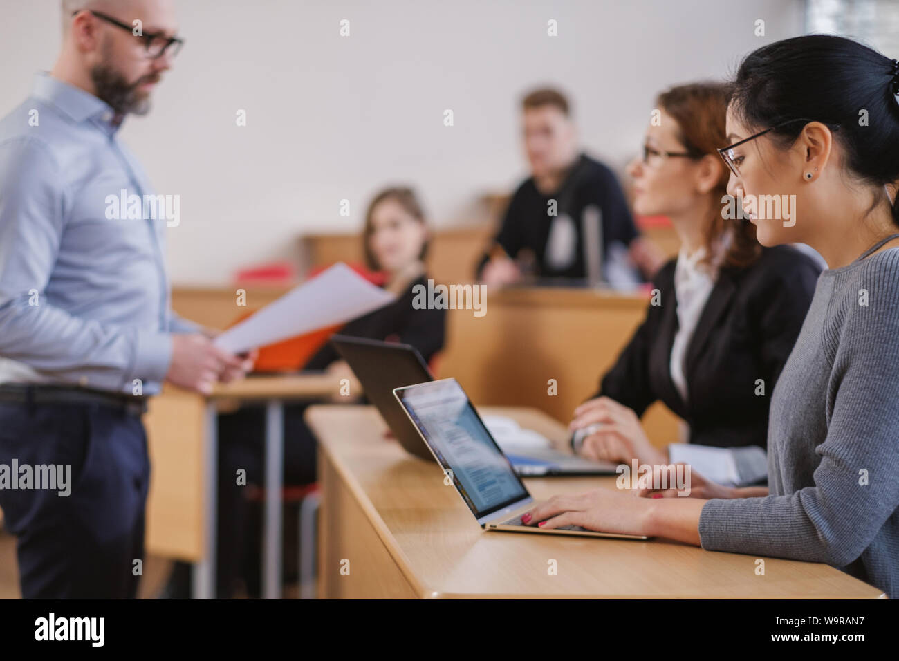 Lecturer and multinational group of students in an auditorium Stock ...