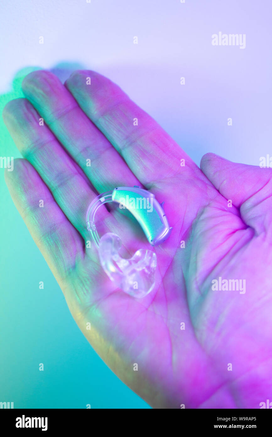 Modern digital hearing aid for deafness and deaf people Stock Photo - Alamy