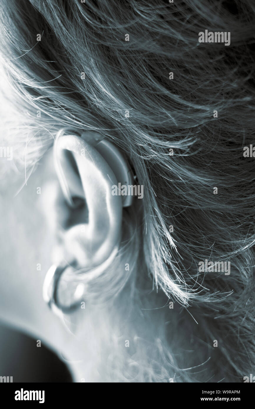 Deaf lady with modern technology digital hearing aid in her ear Stock ...