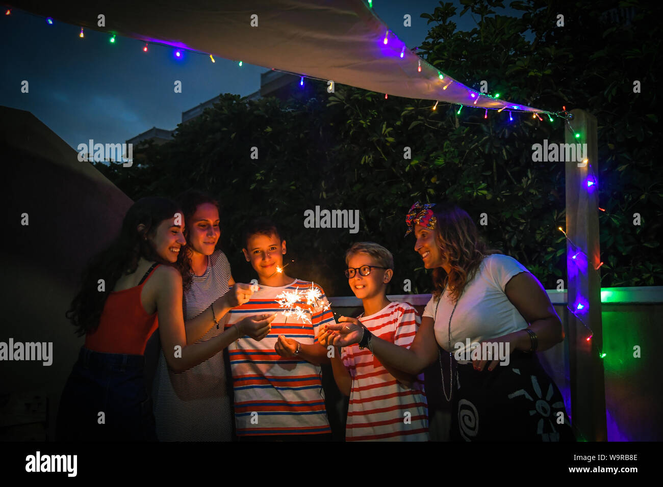 Hand holding firework stick hi-res stock photography and images - Alamy