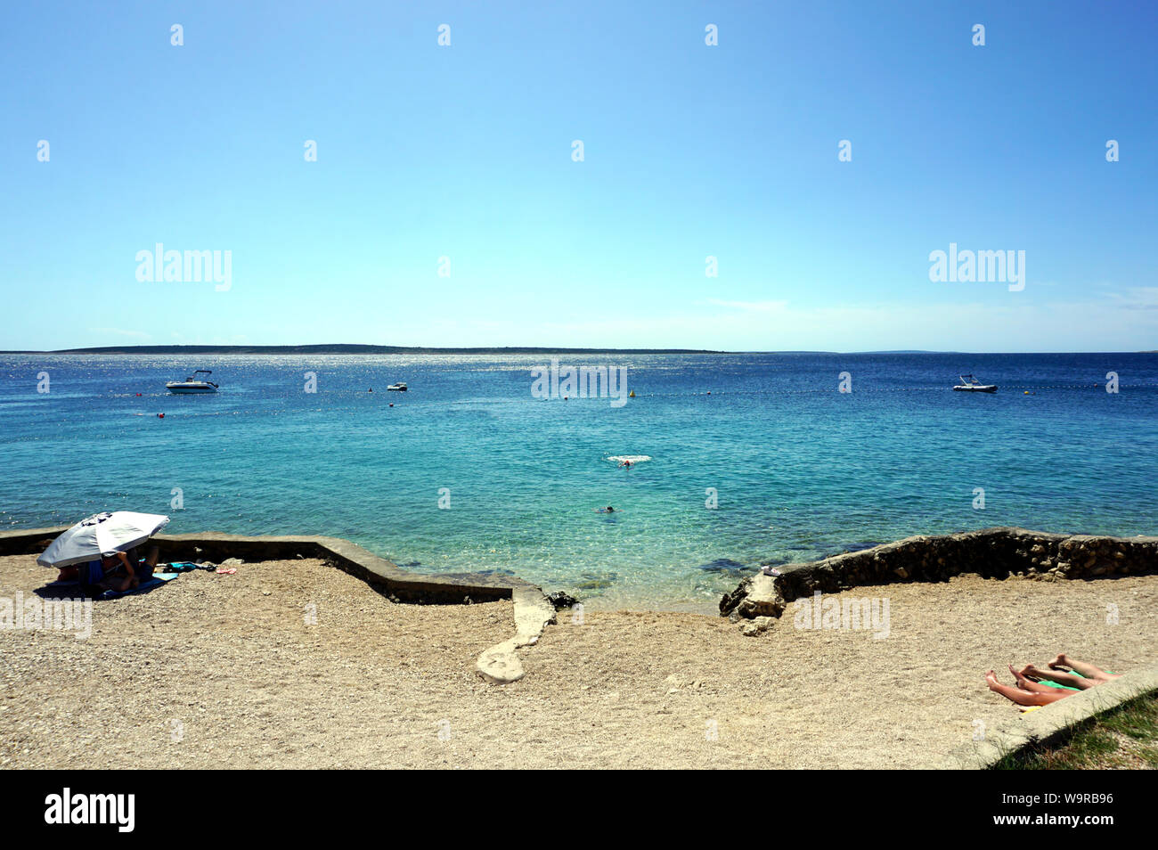 Beautiful peaceful and calming summer day on the pebble beach in the ...