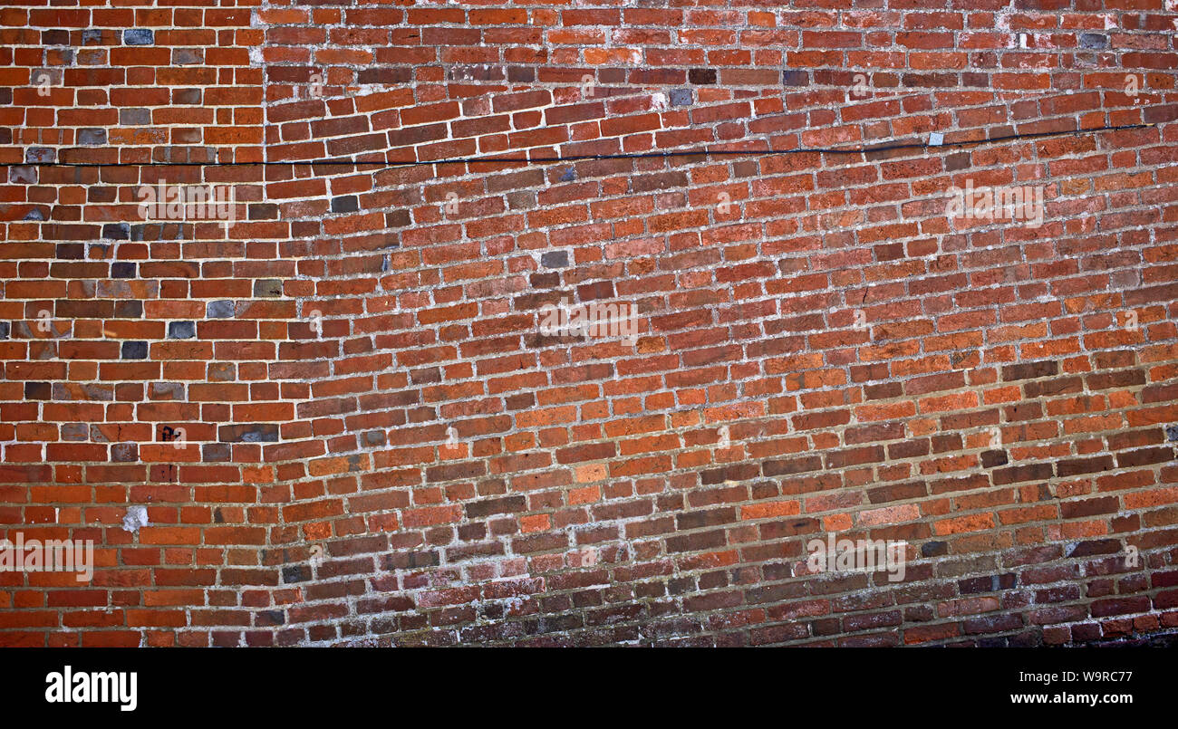 An old brick wall constructed on a slope using mixed bonds, Elephant ...