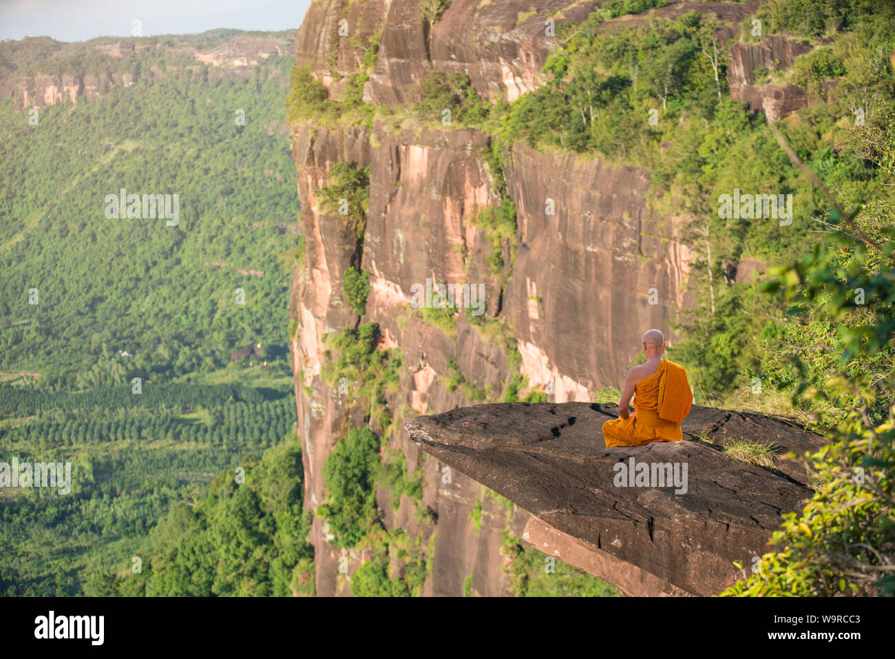 Buddhist monk in meditation at beautiful nature on high mountain Stock ...