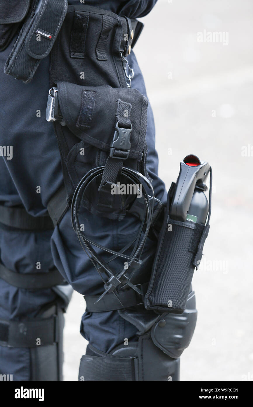 A close up of a policeman from the waist down with police equipment ...