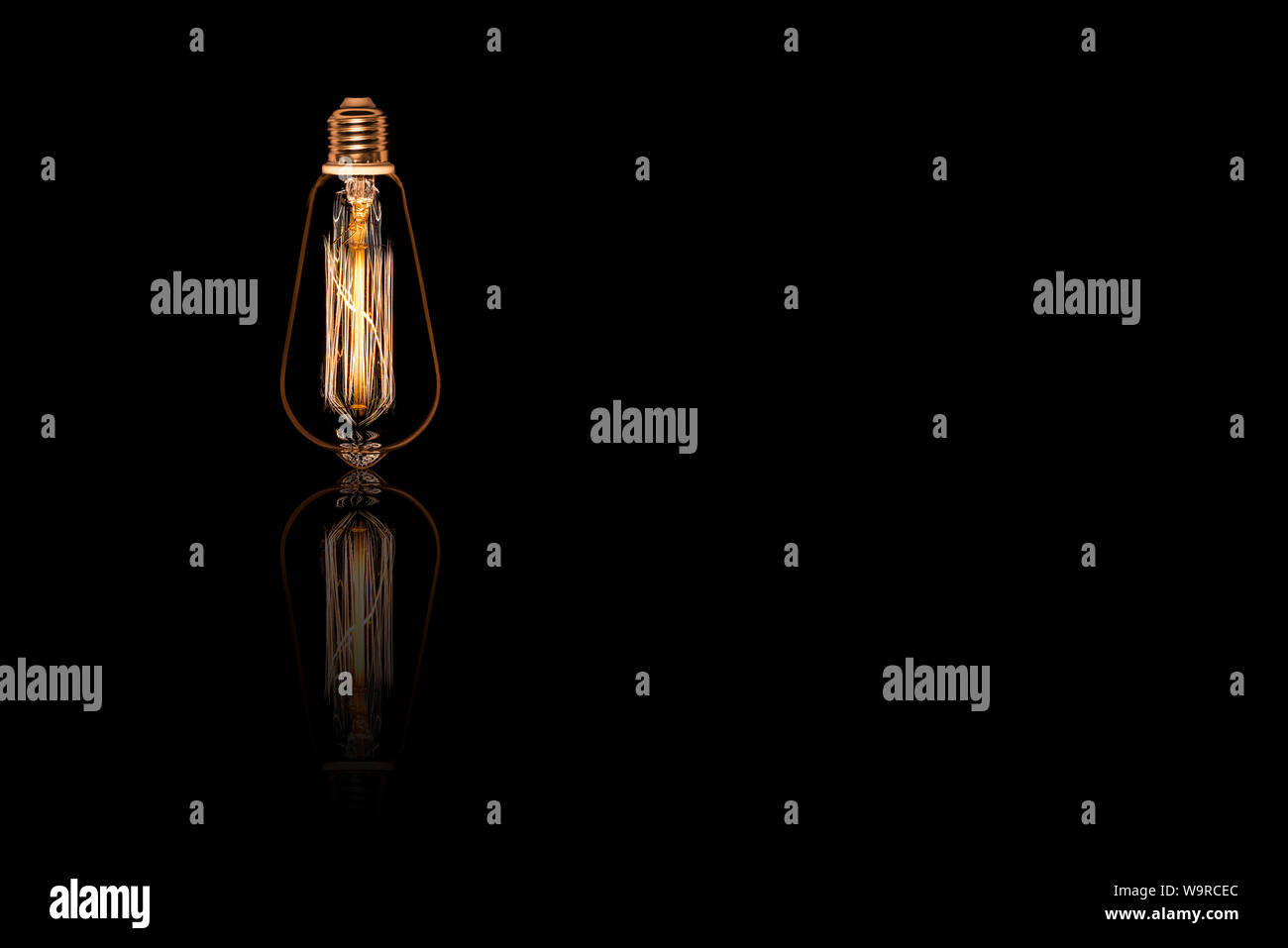 Light bulb with black background hi-res stock photography and images ...