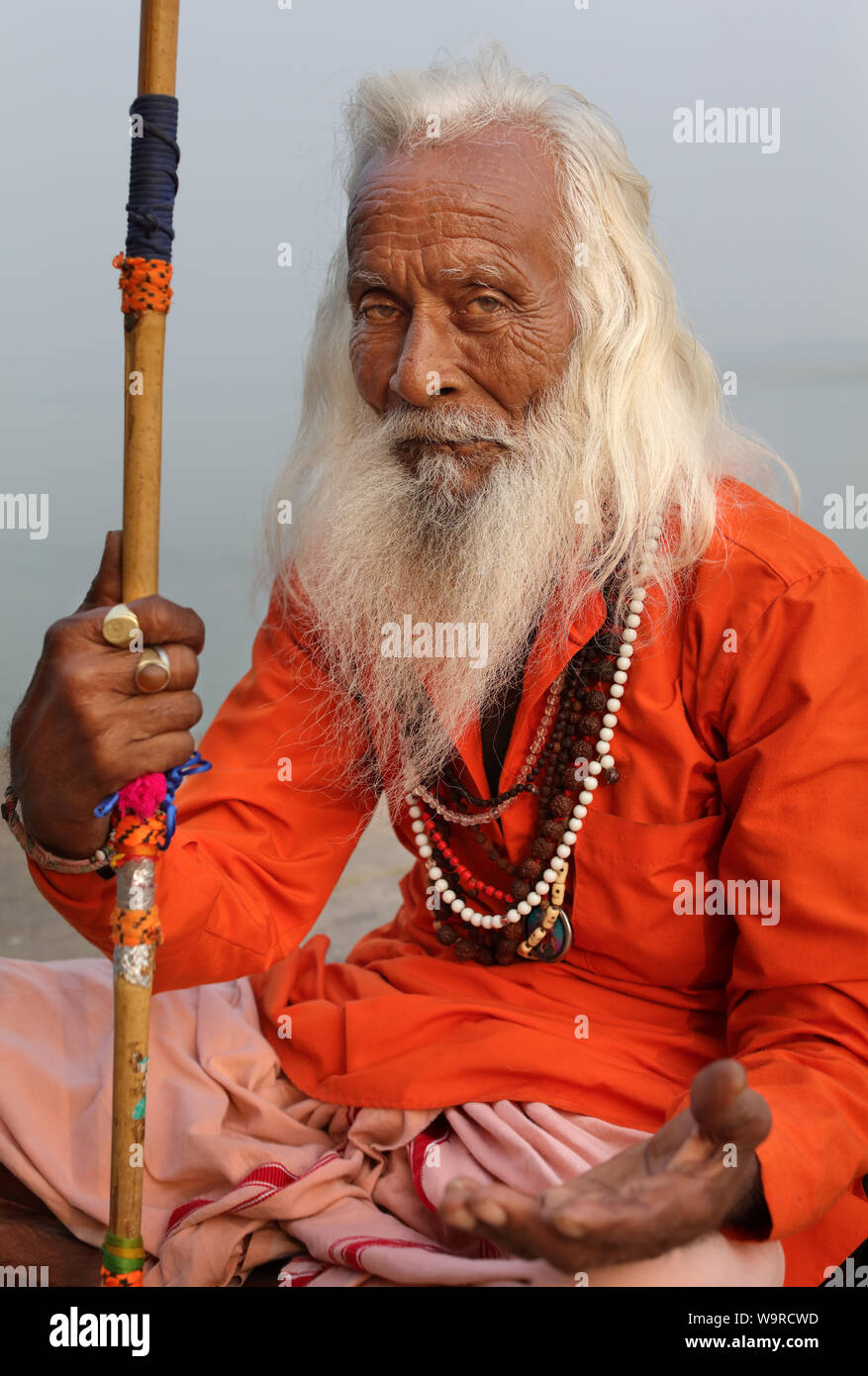 Sadhu (holy man) on the ghats of Ganges in Varanasi, India. Varanasi is ...