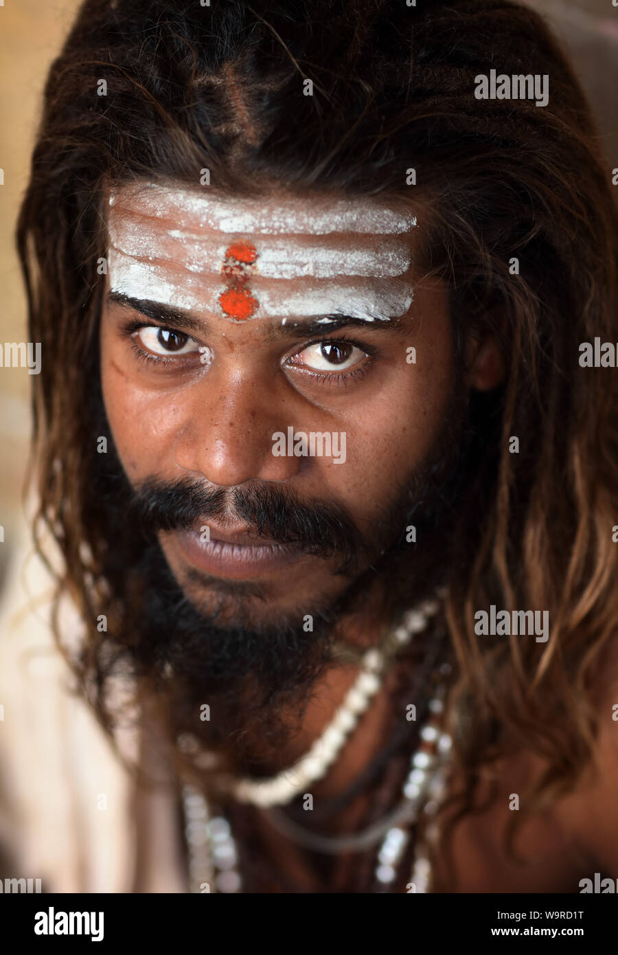 Sadhu (holy man) on the ghats of Ganges in Varanasi, India. Varanasi is ...
