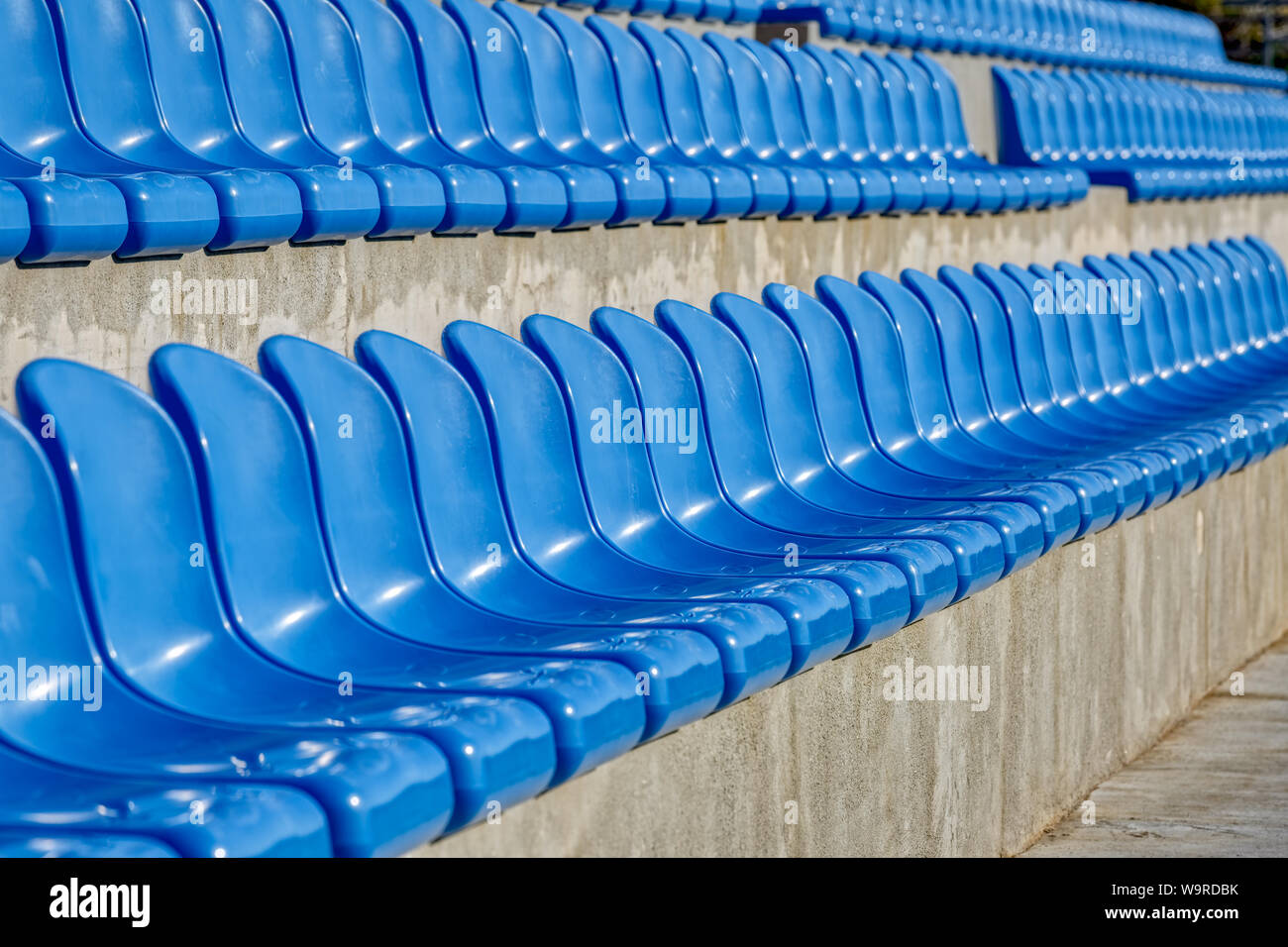 Blue Chairs At The Stadium Stock Photo - Alamy