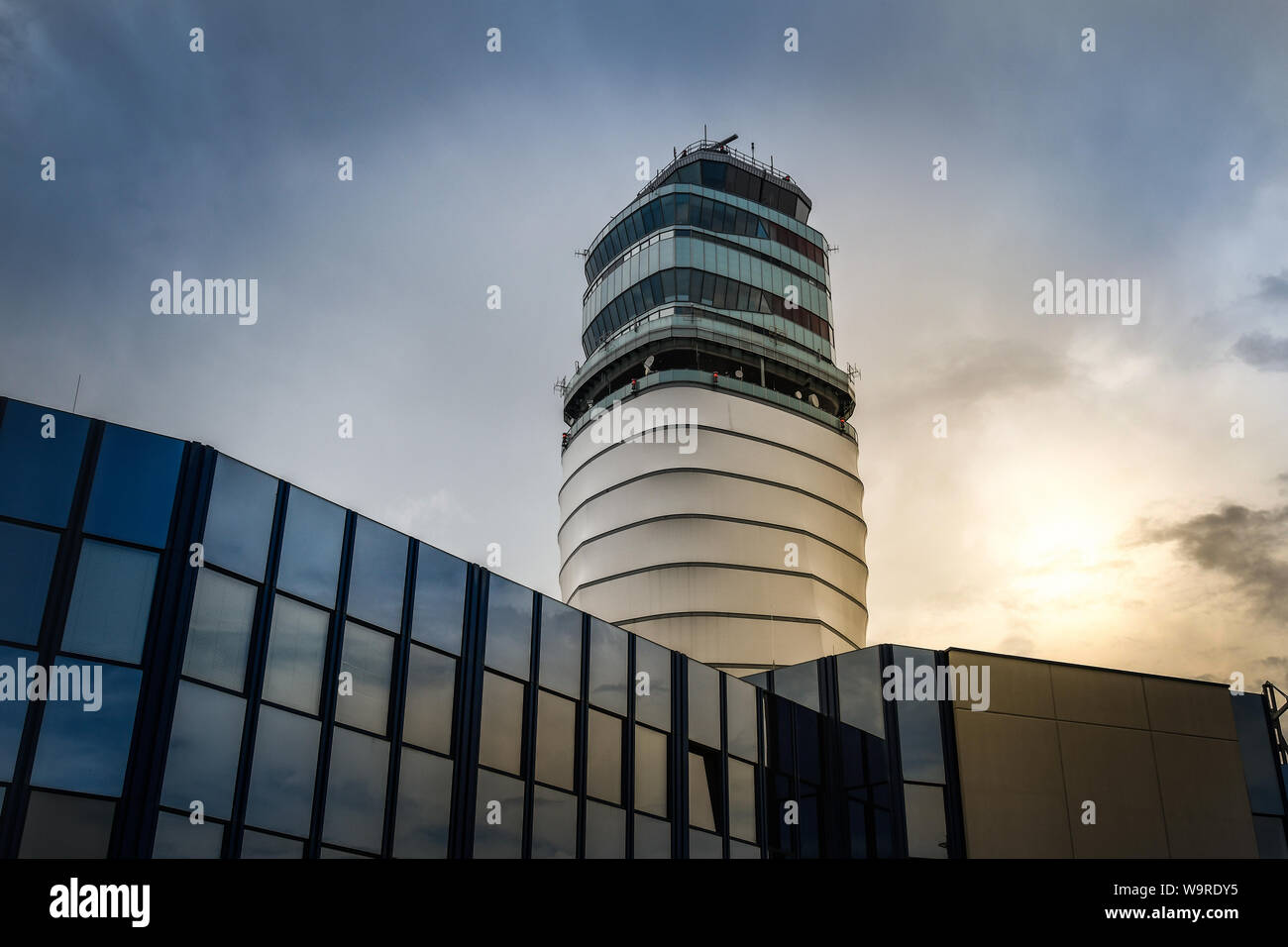 Airport control tower at Vienna in a cloudy evening. Flights management ...