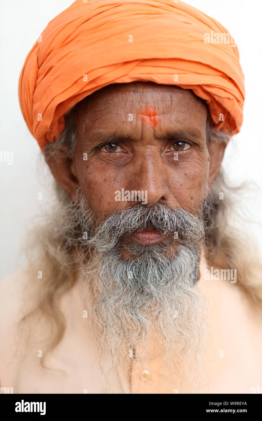 Sadhu (holy man) on the ghats of Ganges in Varanasi, India. Varanasi is ...