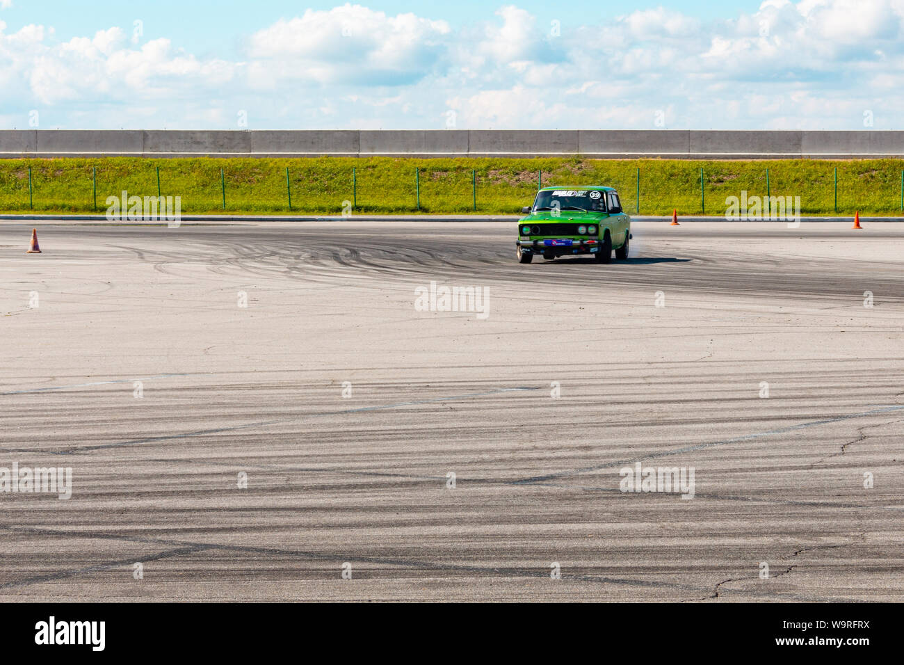 The guy on the car Lada green trains to drift Stock Photo - Alamy