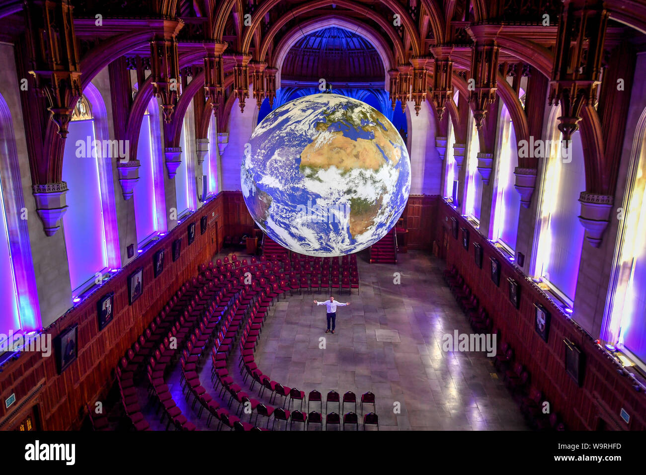 Artist luke jerram stands beneath hi-res stock photography and images ...