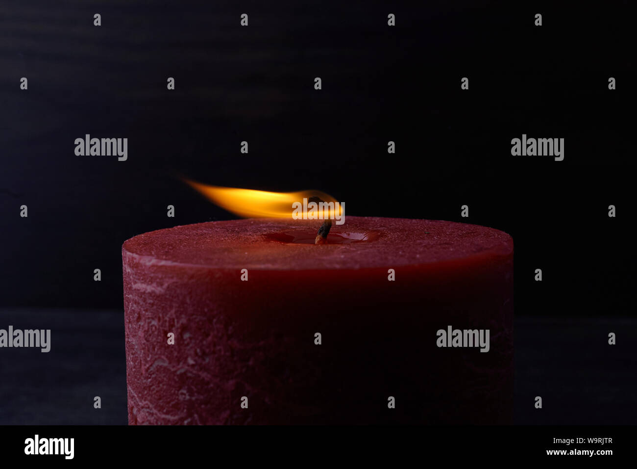 One Candle light on black background. Hope concept Stock Photo - Alamy