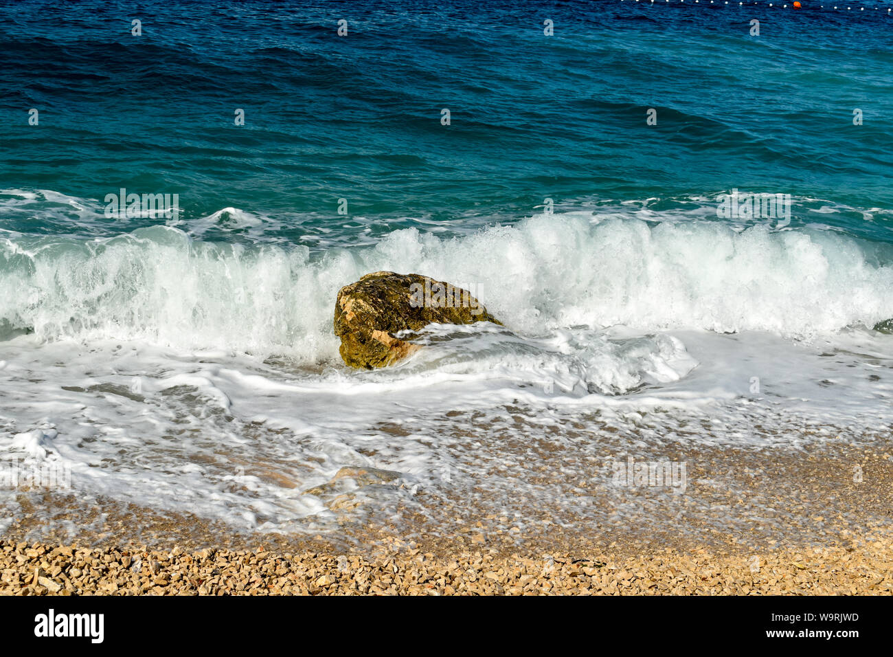 Seashore with splashing waves Stock Photo - Alamy