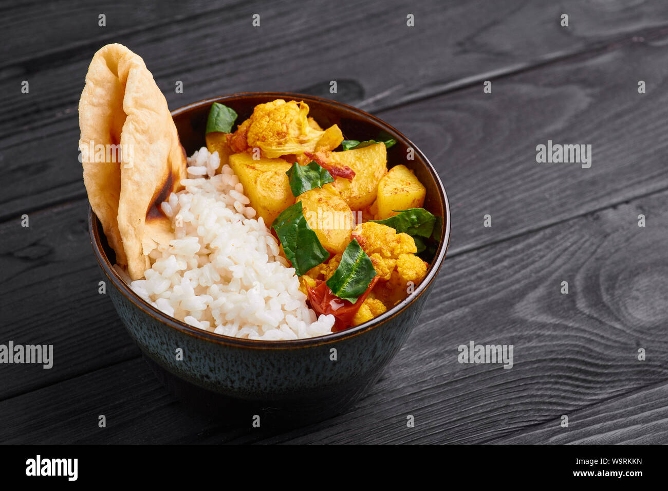 aloo gobi with rice and chapati. Indian cuisine vegetarian curry cooked ...