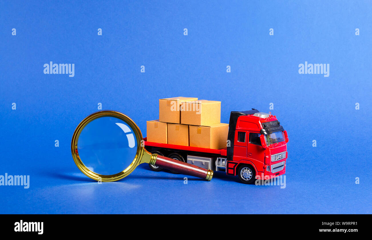 Red truck loaded with boxes and a magnifying glass. Search for a ...