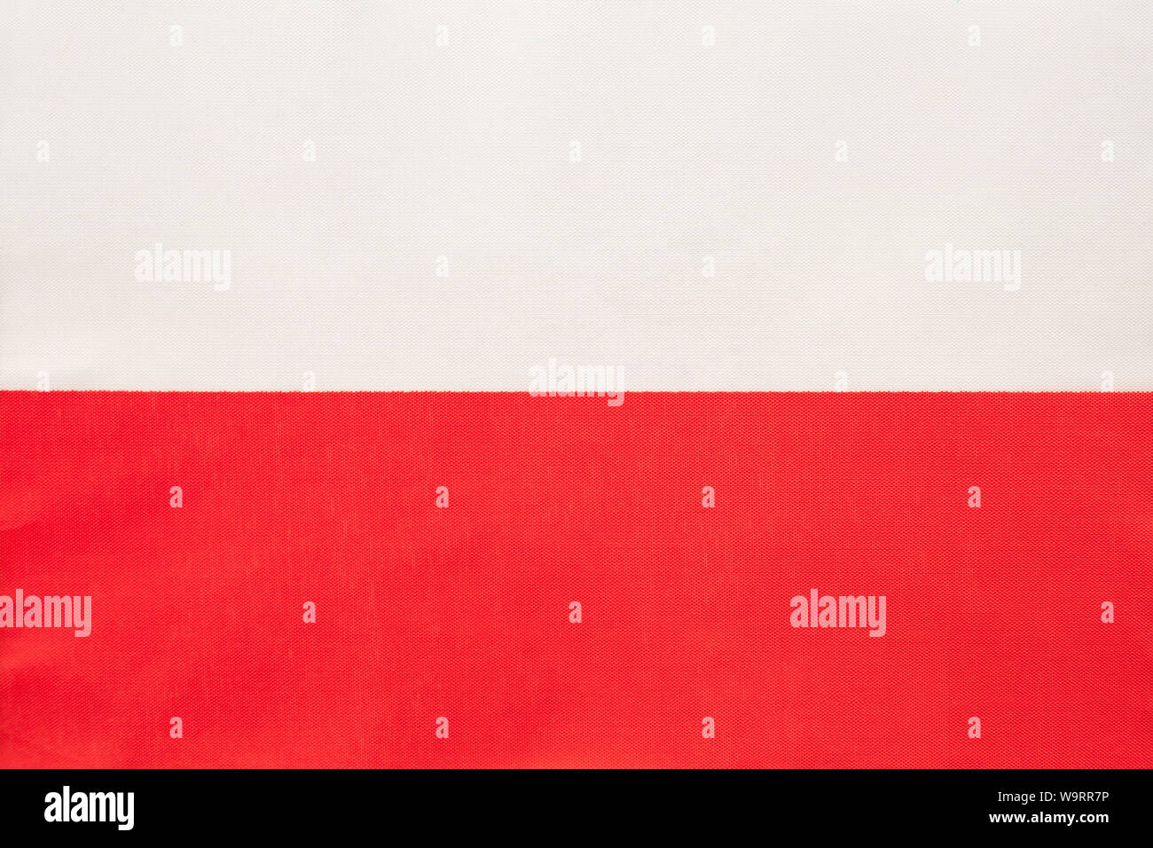 Poland national fabric flag with emblem, textile background. Symbol of ...