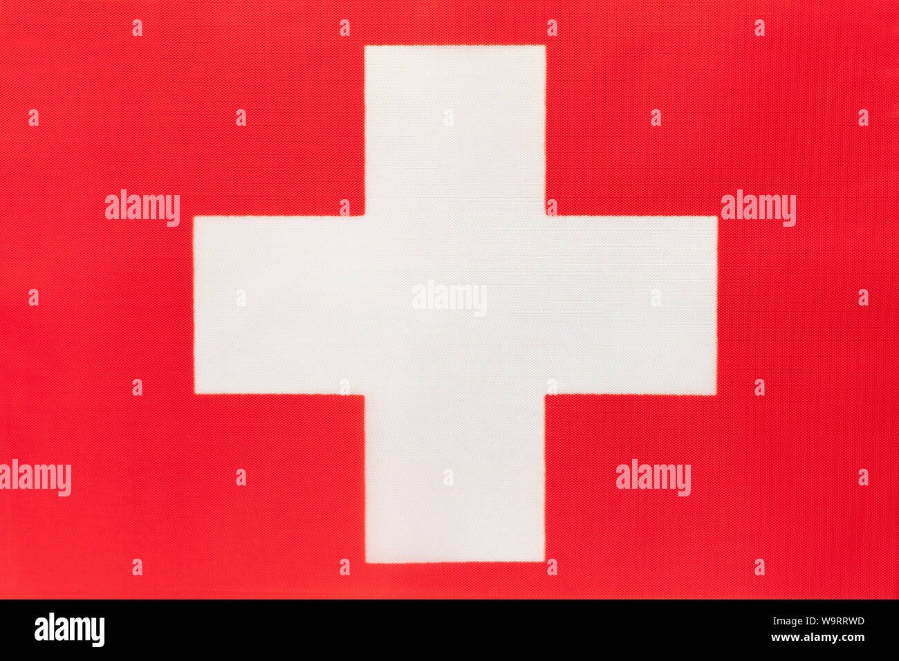 Switzerland national fabric flag with emblem, textile background ...