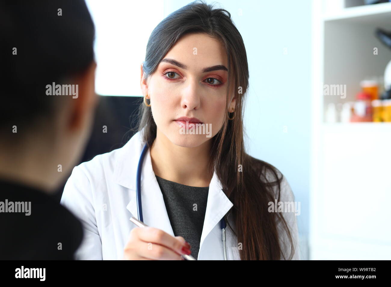 Beautiful smiling female doctor talk with patient Stock Photo - Alamy