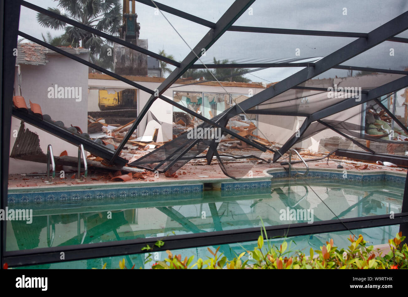 house being demolished; pool, lanai, cage falling, screening ...