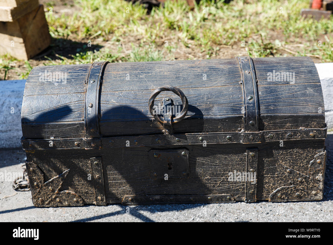 Large black metal chest. Old metal chest Stock Photo - Alamy