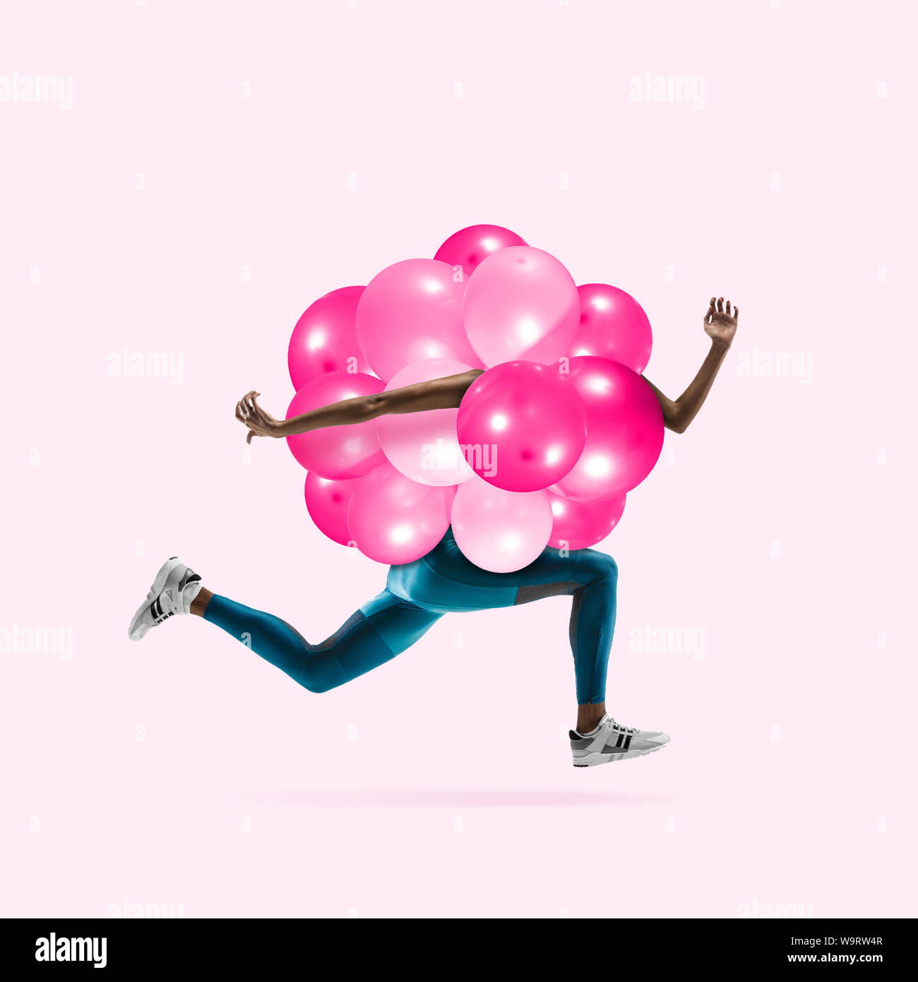 Run like you are weightless. Female body as pink balloons on coral ...
