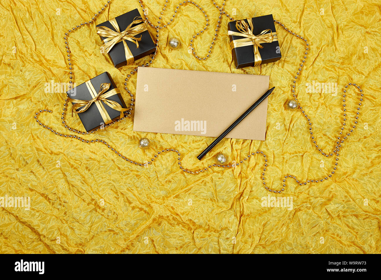 Pile of handmade luxury black gift boxes with gold ribbon DIY ...