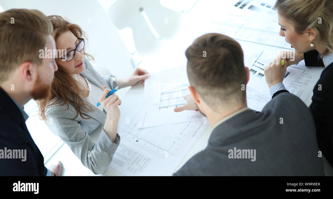 Group of architects working together on project Stock Photo - Alamy