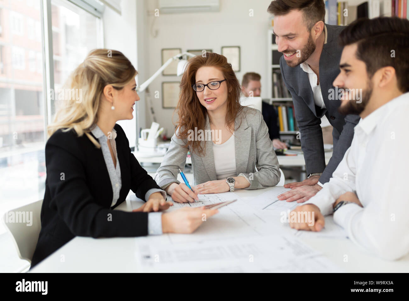 Business team working together analyzing hi-res stock photography and ...