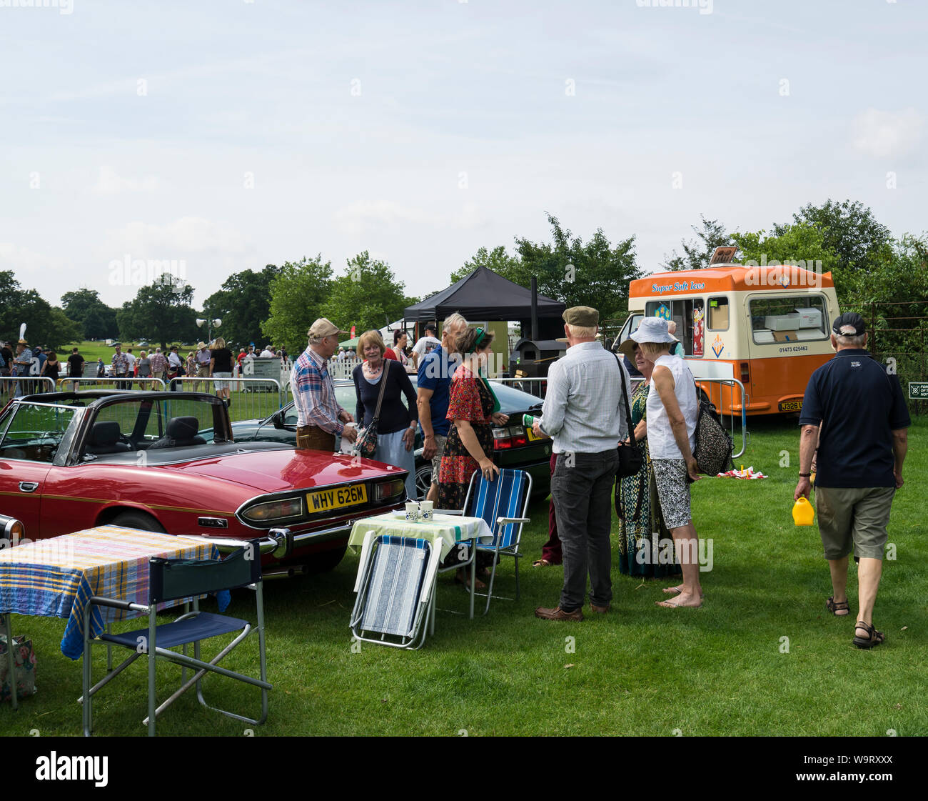 People and friends gathered talking about classic cars hi-res stock ...
