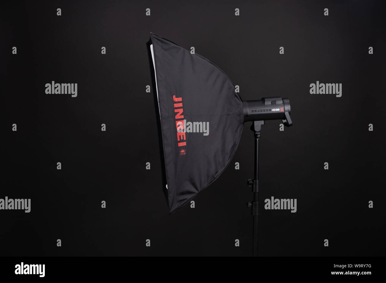 professional softbox over black background. A dark black studio softbox ...
