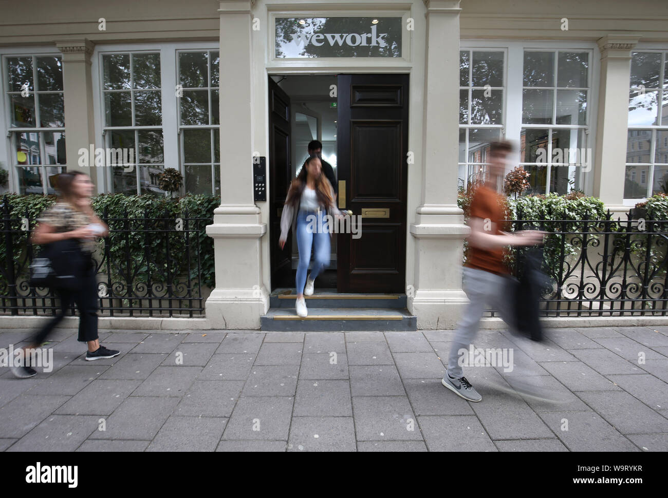 Signage outside the co-working office space group, WeWork, at Soho ...