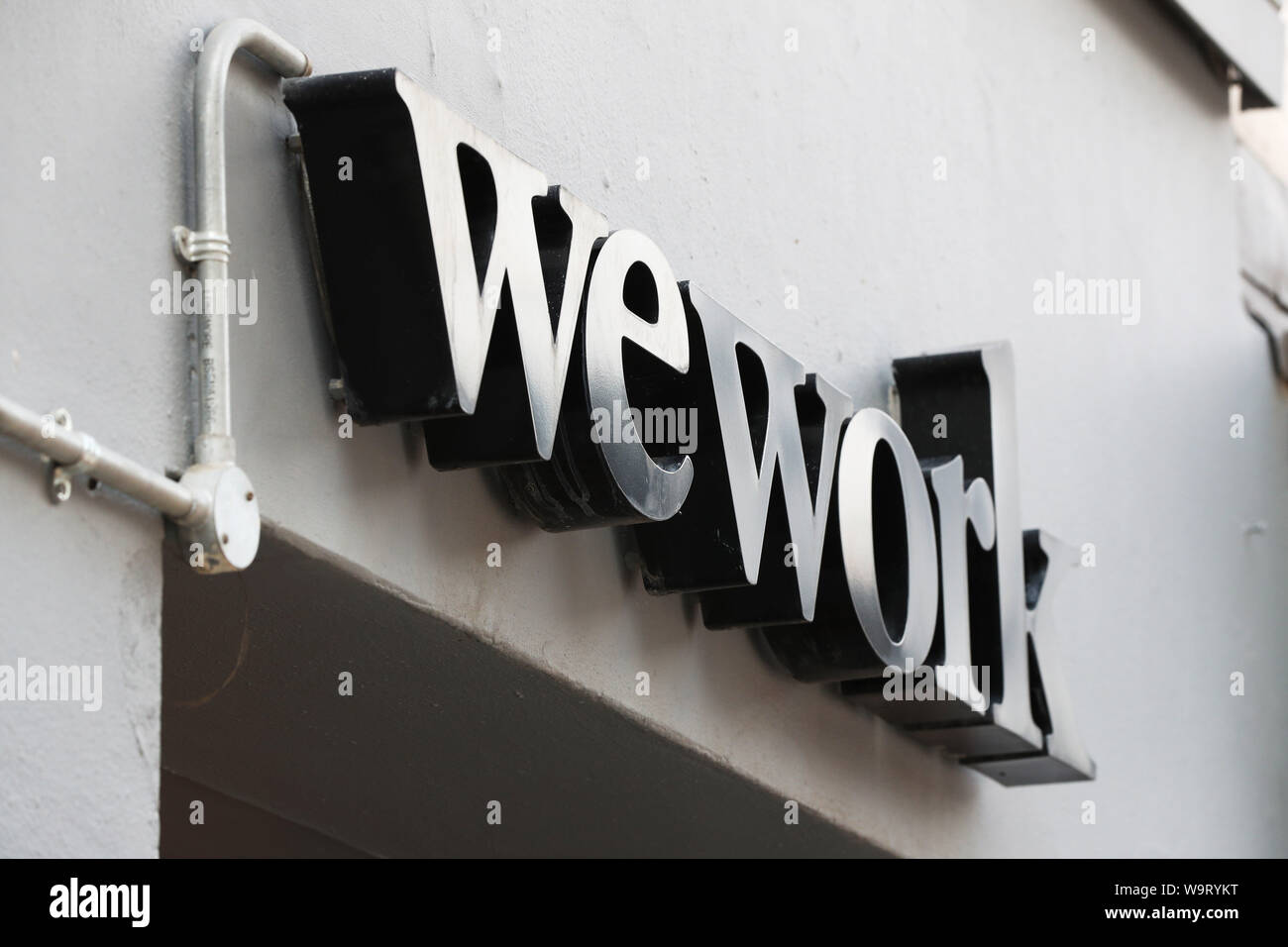 Signage outside the co-working office space group, WeWork, at Chapel ...