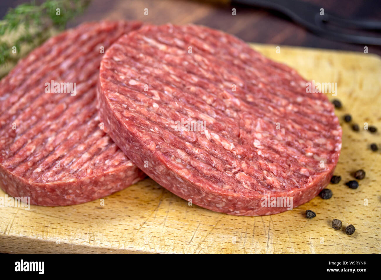 raw beef ground steaks on a cutting board Stock Photo - Alamy