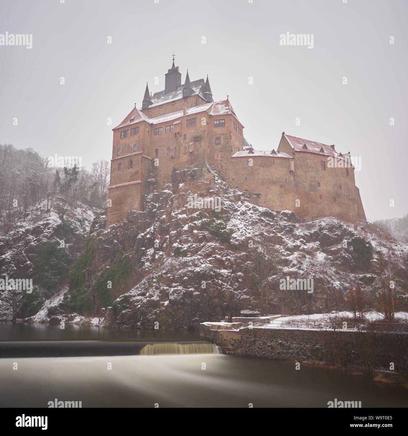 A medieval castle in the middle of a cold winter landscape. The ...