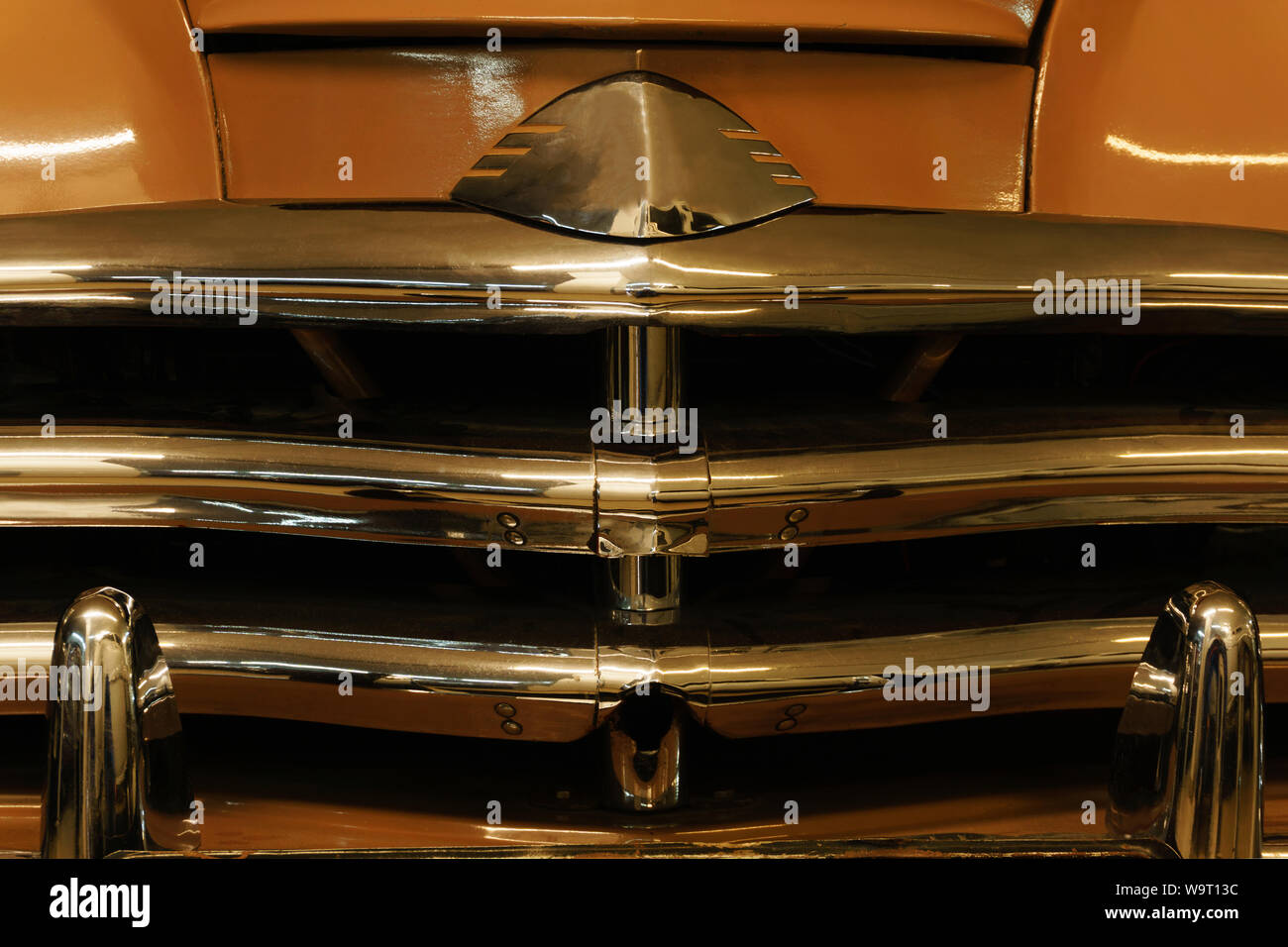 background - the front part of a vintage car, detail of the radiator ...