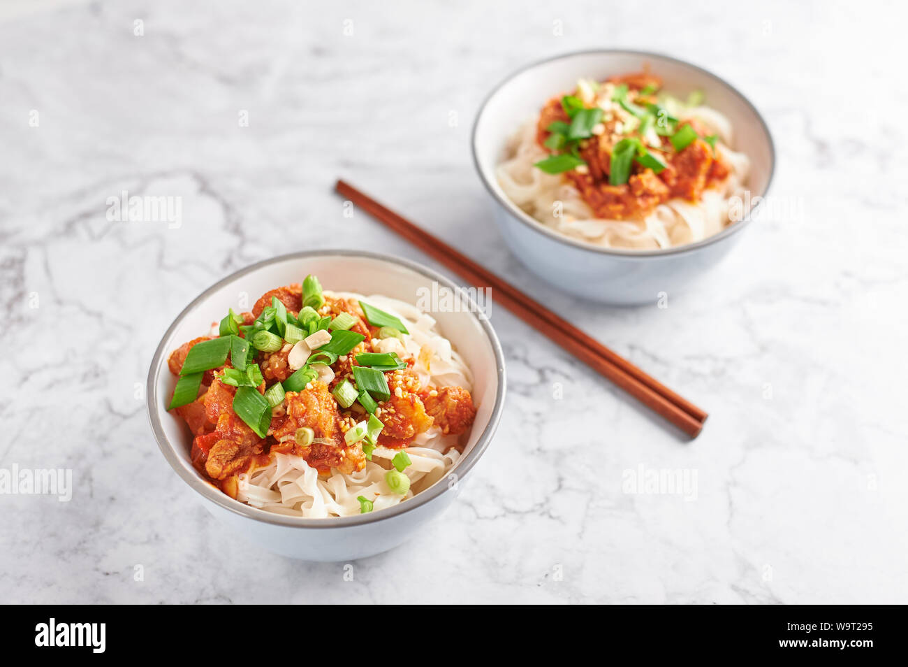 shan noodles with chopsticks at white marble tabletop. burmese cuisine ...