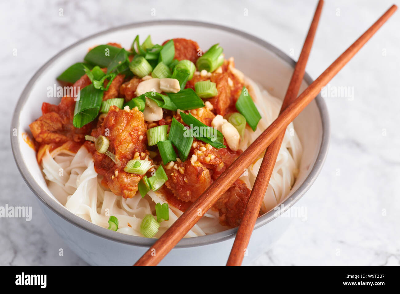 shan noodles with chopsticks at white marble tabletop. burmese cuisine ...