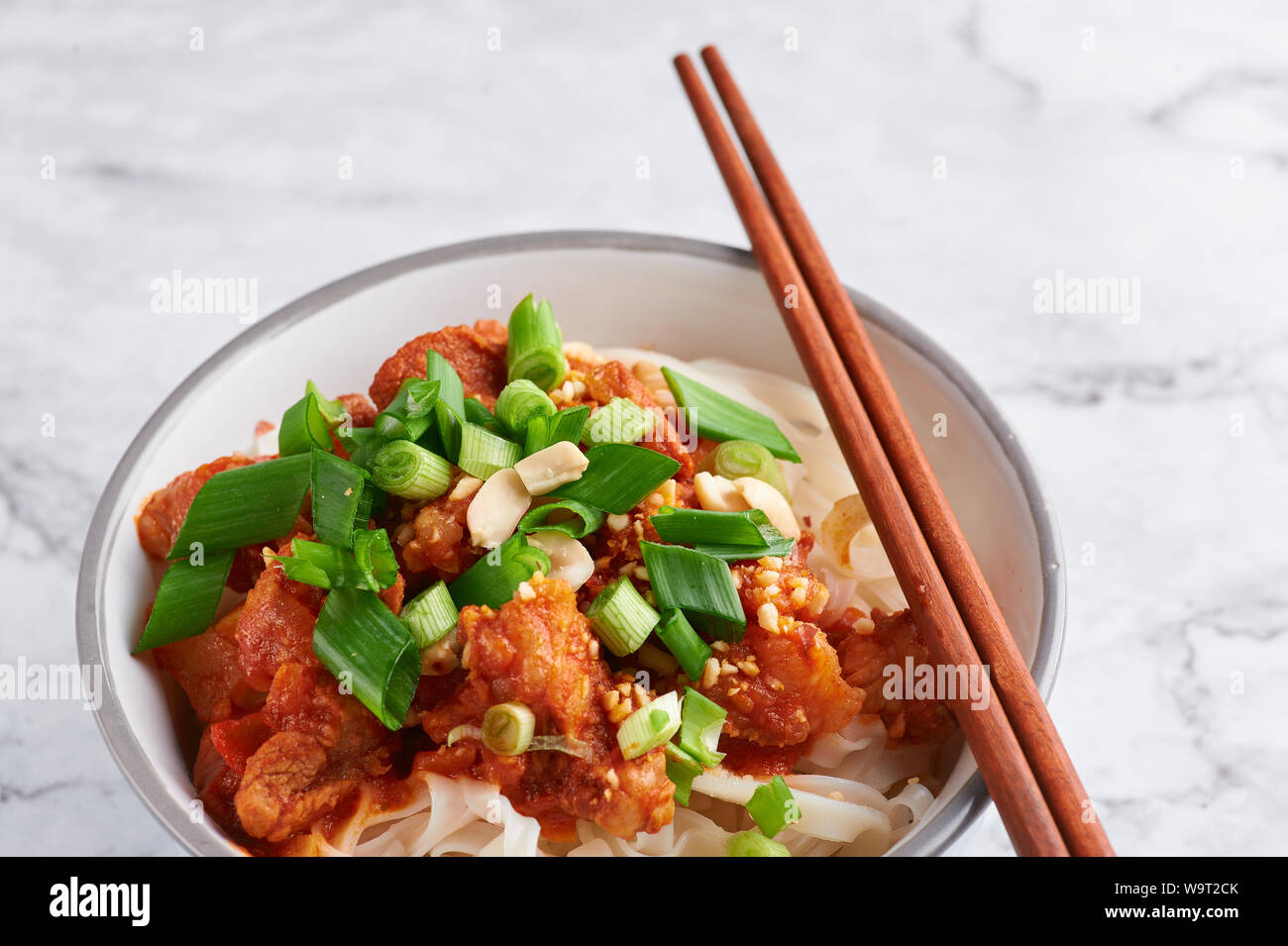 shan noodles with chopsticks at white marble tabletop. burmese cuisine ...