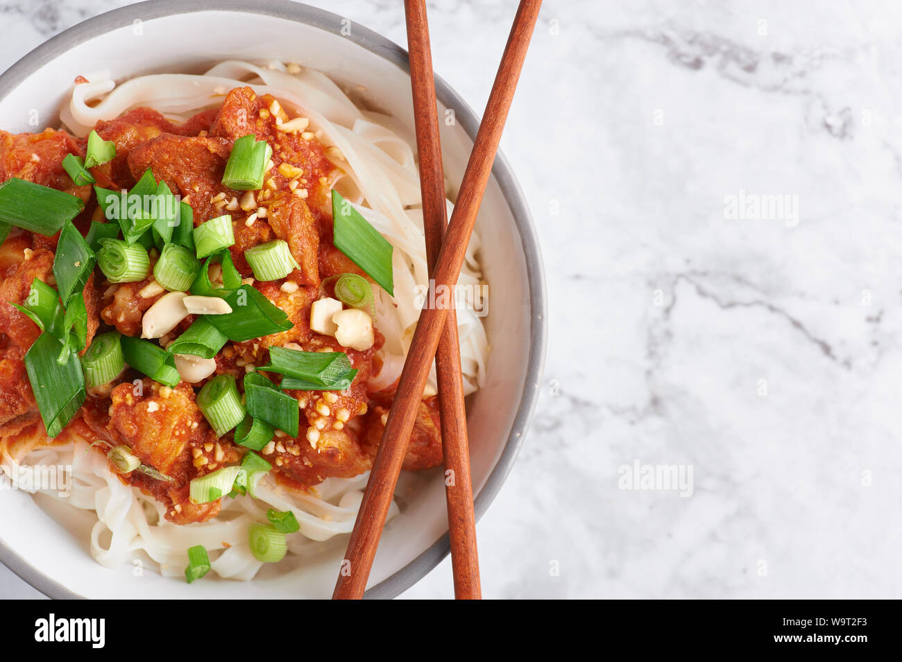 shan noodles with chopsticks at white marble tabletop. burmese cuisine ...