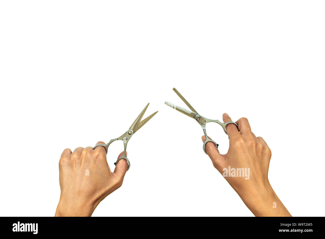 Hands holding pair of open stylish professional barber scissors ...