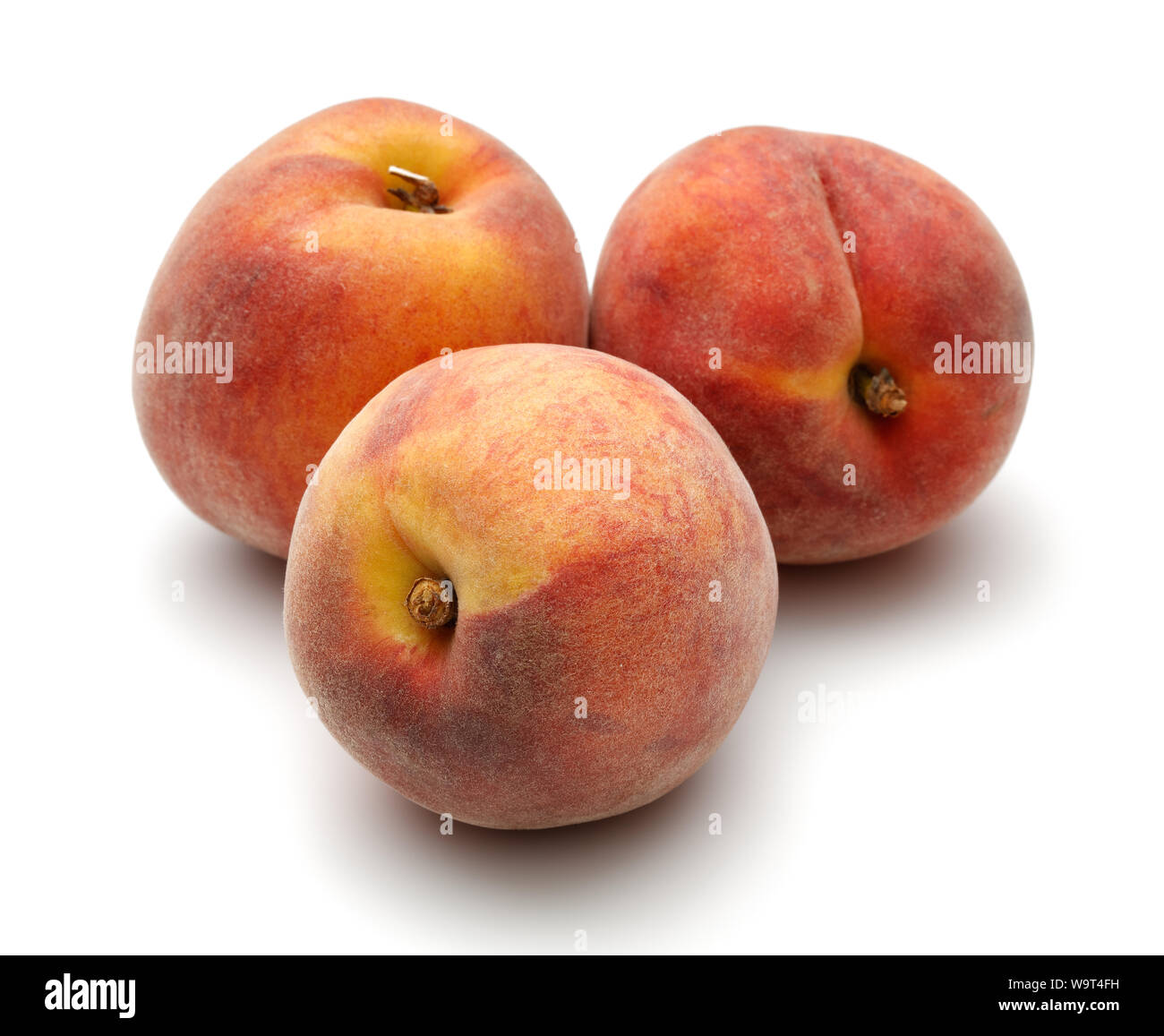 Three whole peaches isolated on white background Stock Photo - Alamy