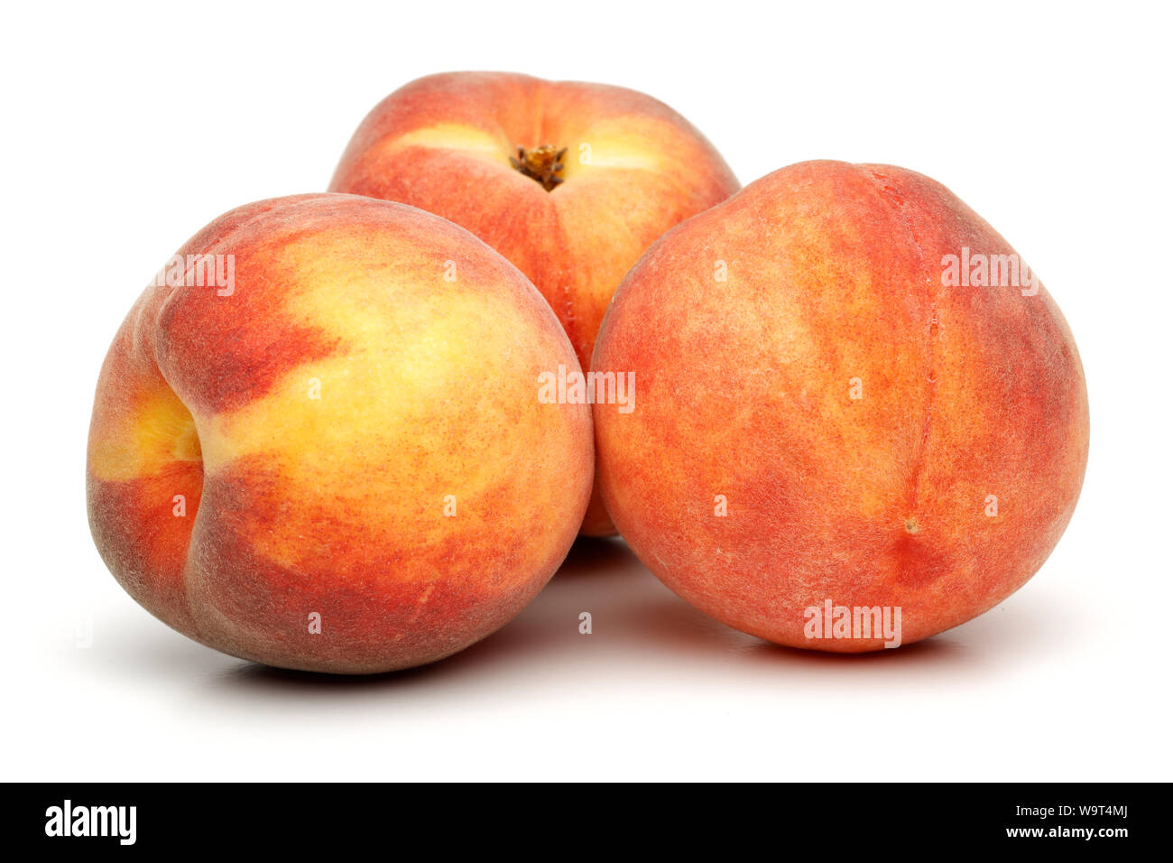 Three whole peaches isolated on white background Stock Photo - Alamy