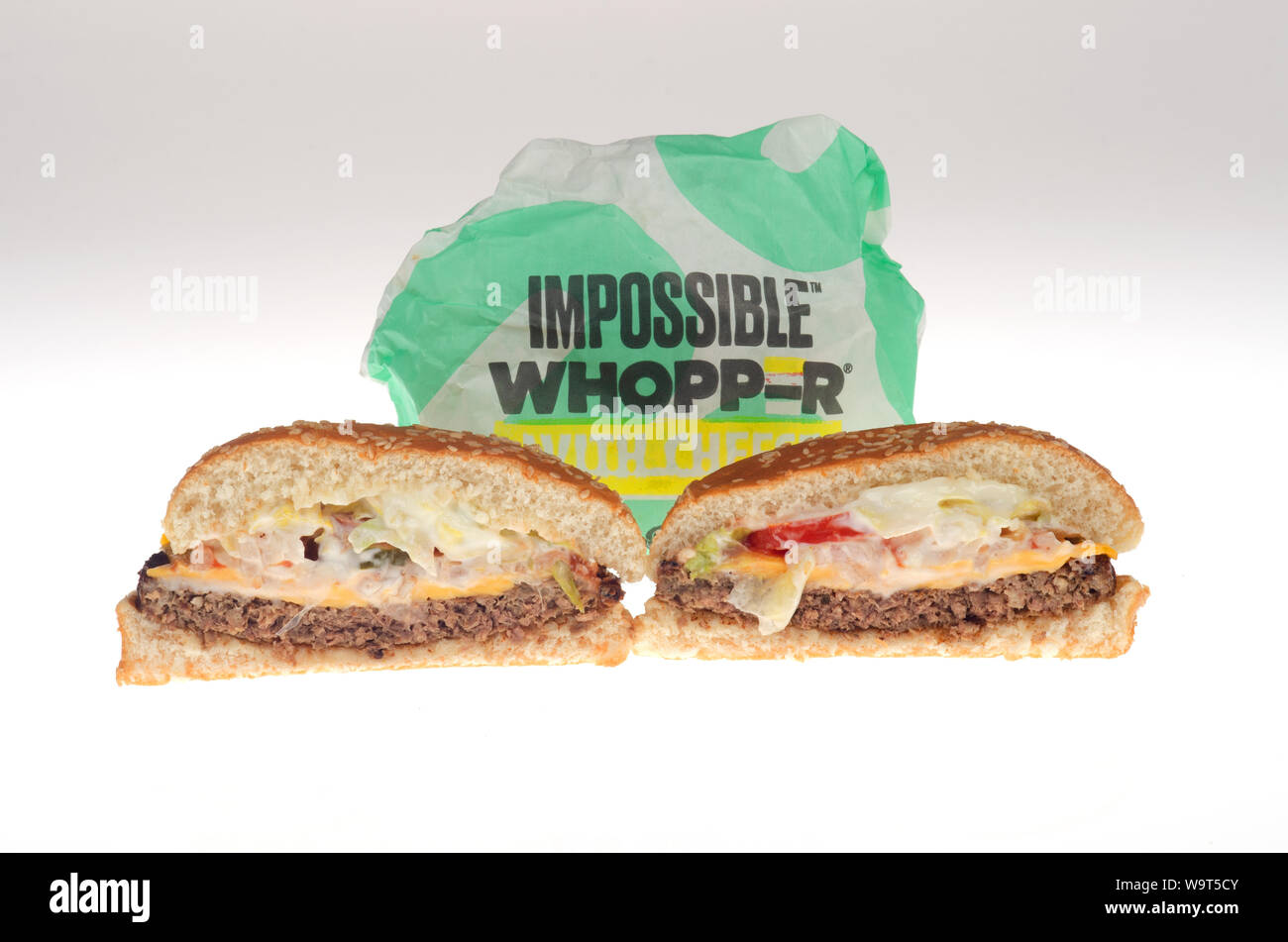 Burger King Impossible Whopper with cheese cut in half showing ...