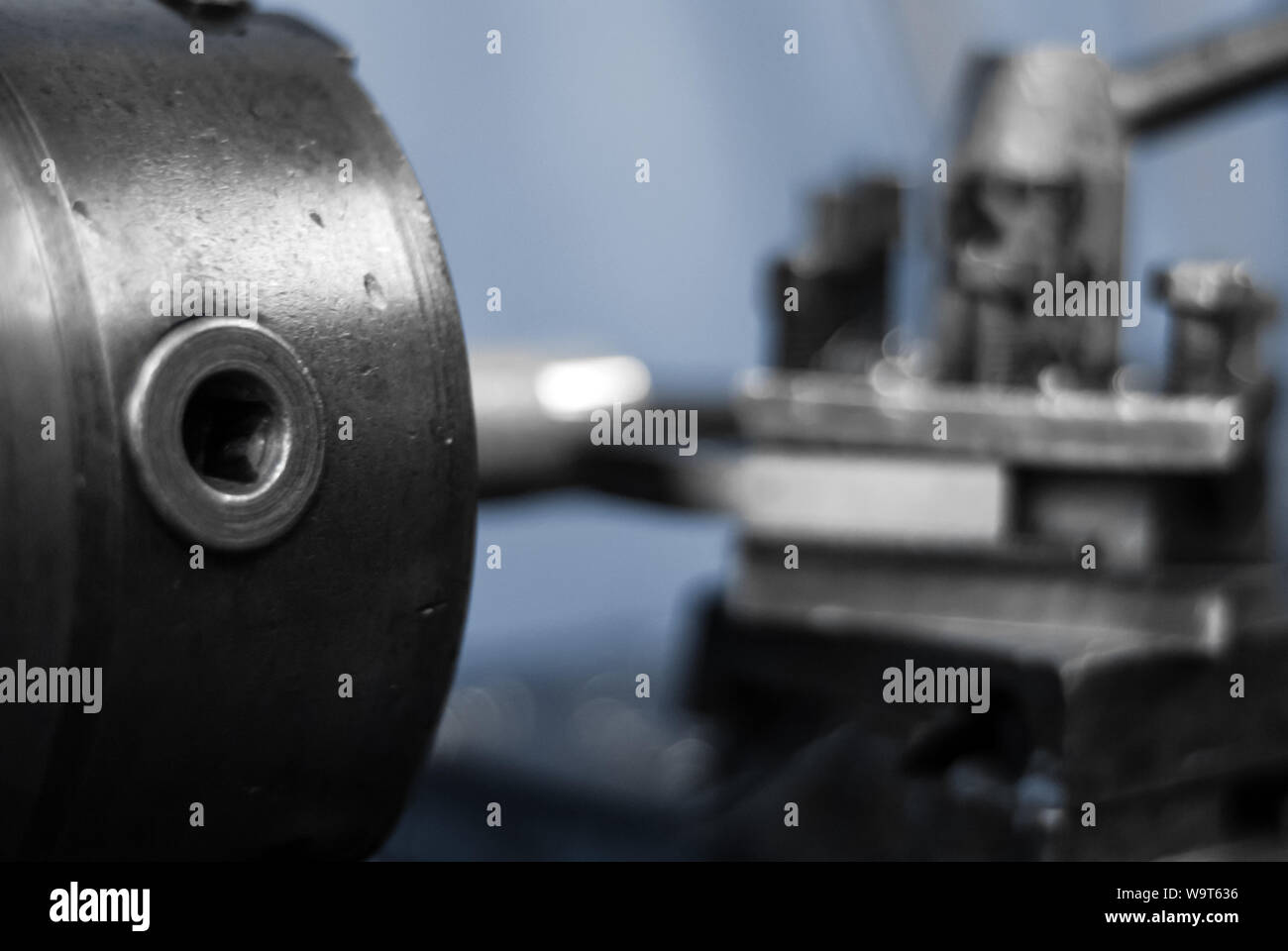 background - detail of the machine, the spindle of turning lathe while ...