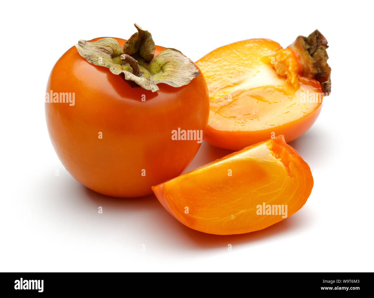 Whole and sliced ripe persimmon fruits isolated on white background ...
