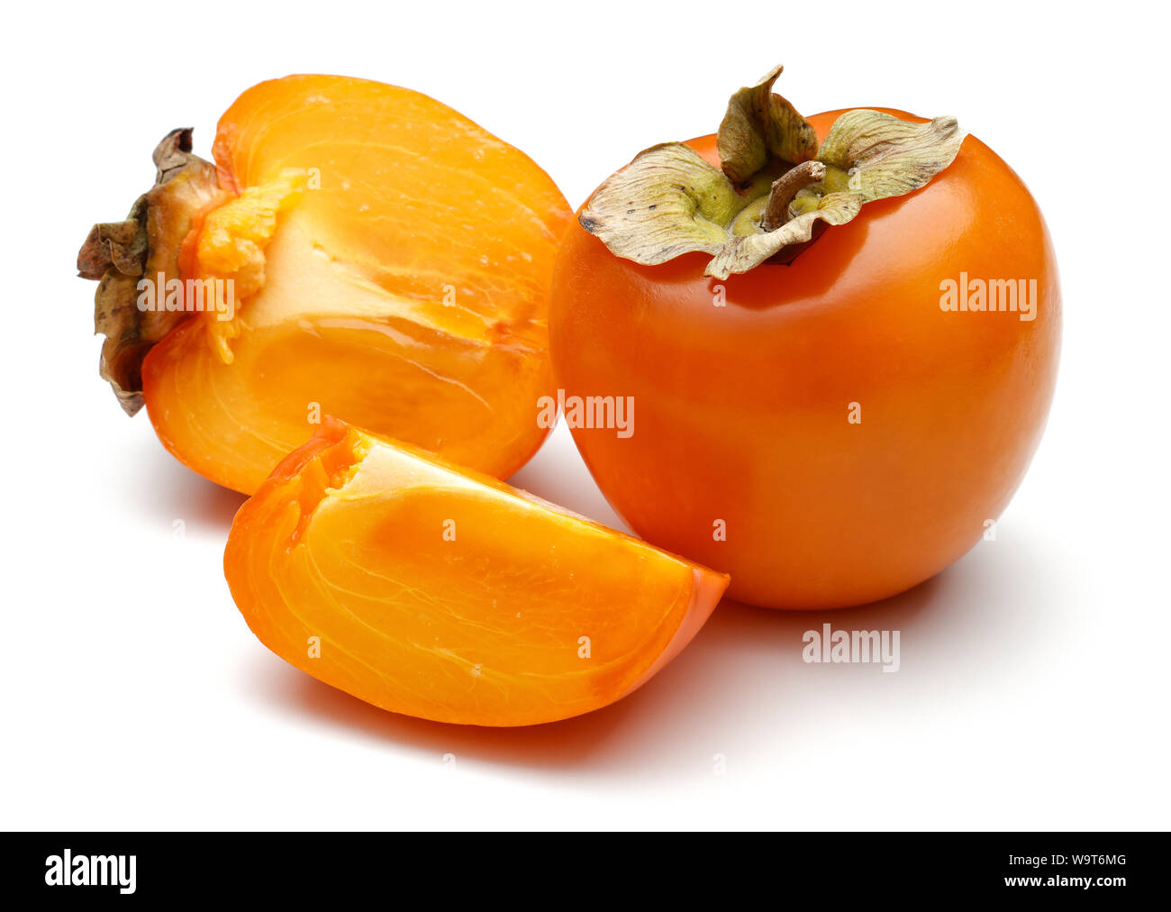 Whole and sliced ripe persimmon fruits isolated on white background ...