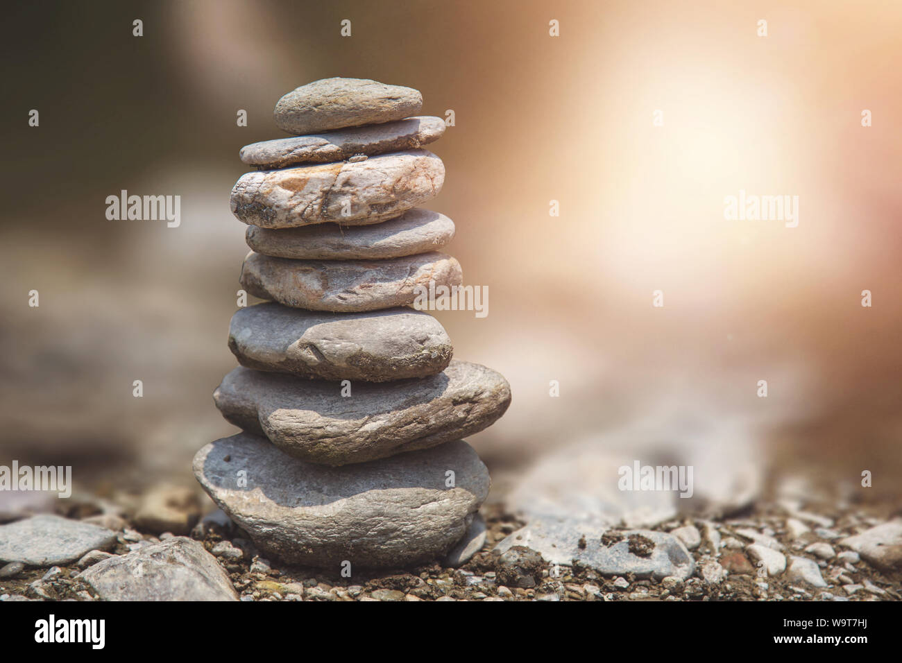 River stones Balanced on the Rock. Pyramid of river stones on of one ...
