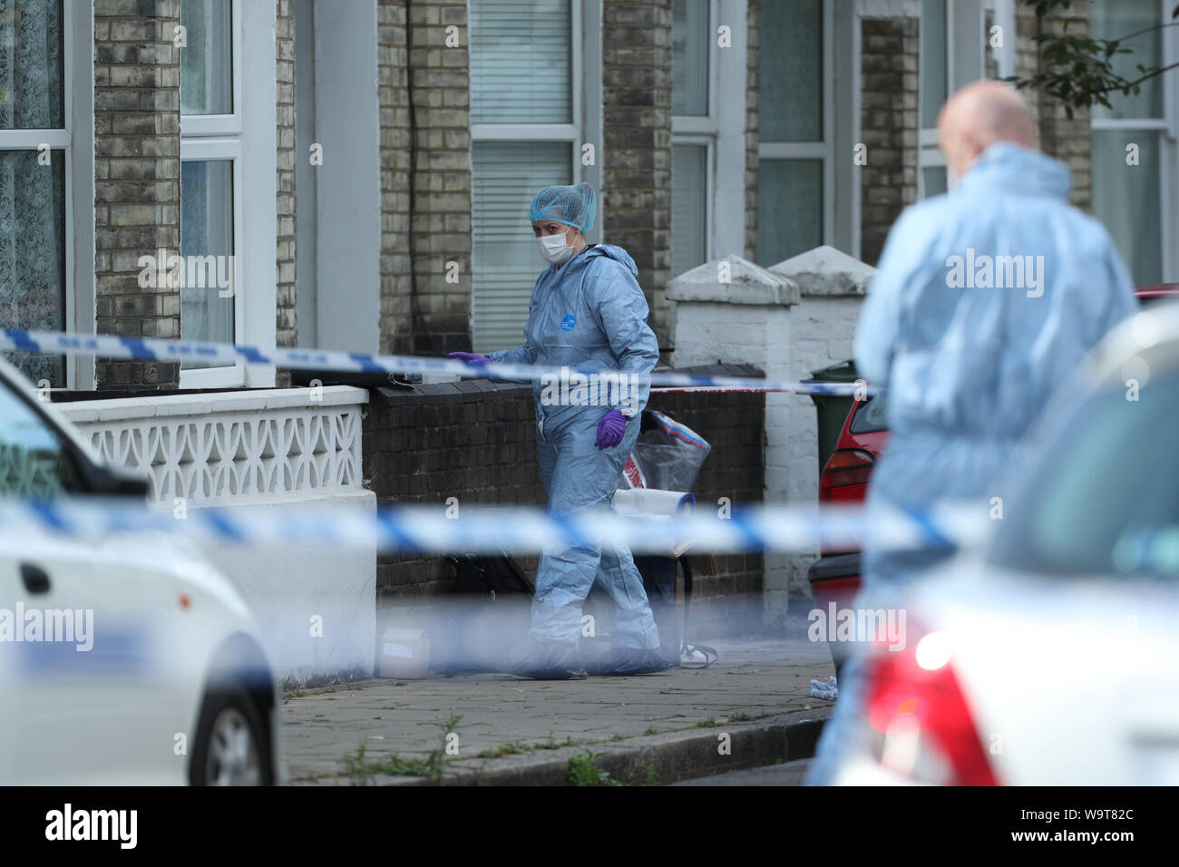 Forensic officers at the scene of a fatal stabbing in Corrance Road ...