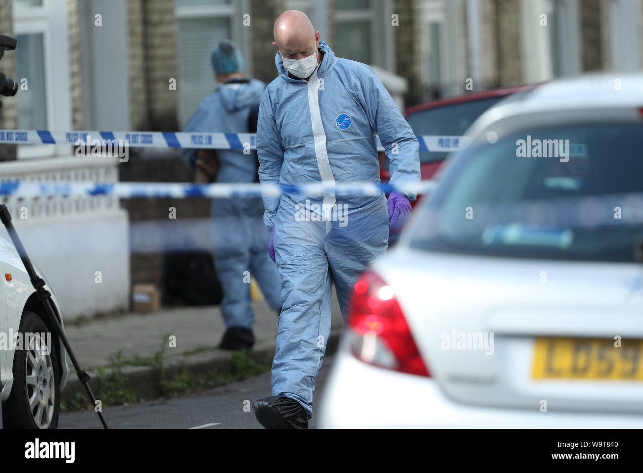 Forensic officers at the scene of a fatal stabbing in Corrance Road ...